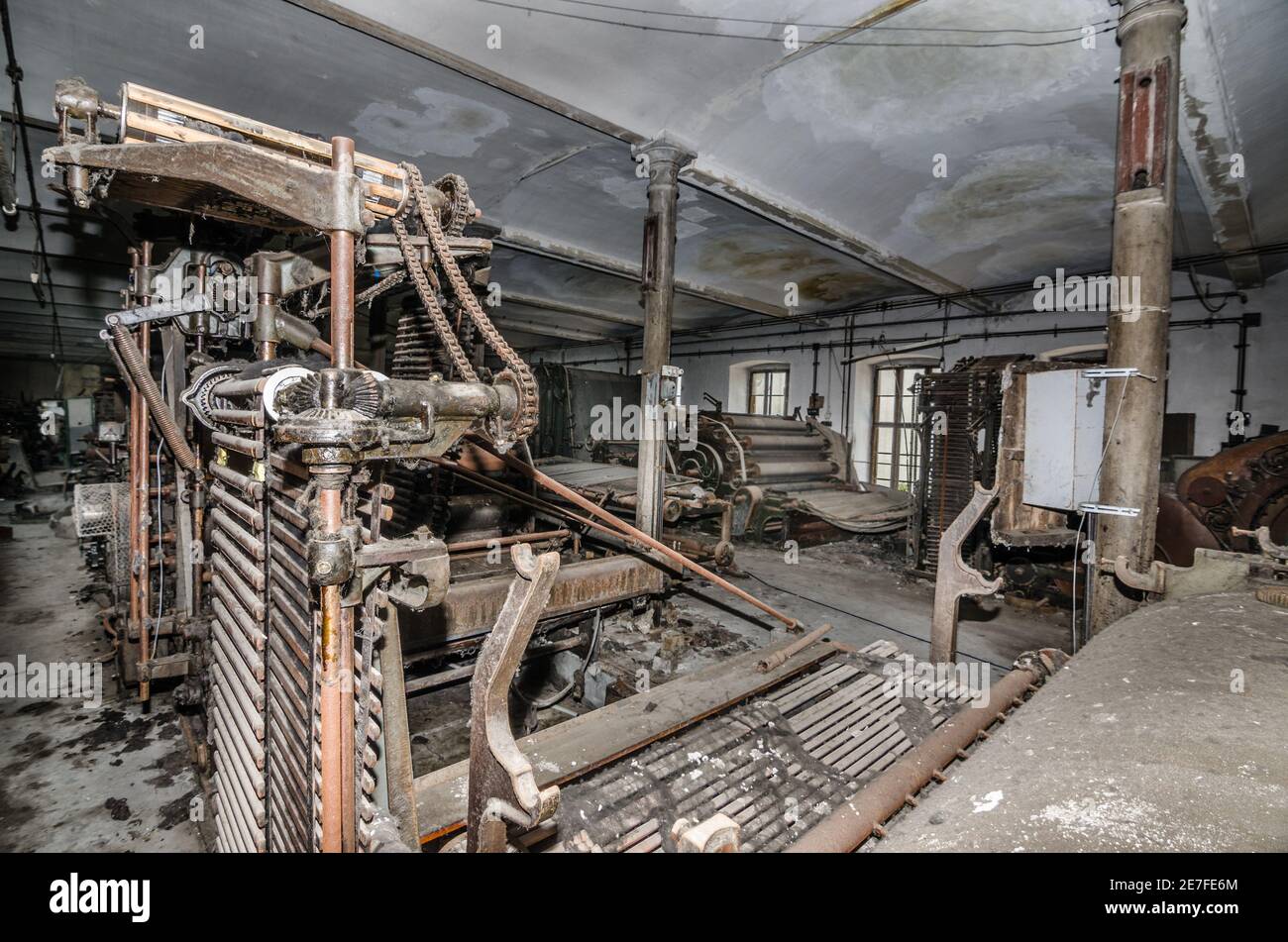 abandoned hall with machines in a factory Stock Photo - Alamy