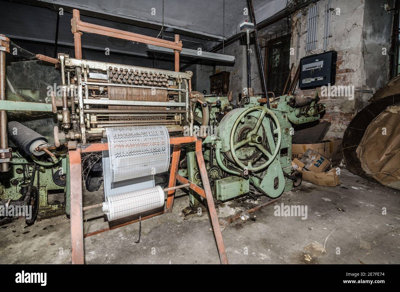 hole machine in an old factory Stock Photo - Alamy