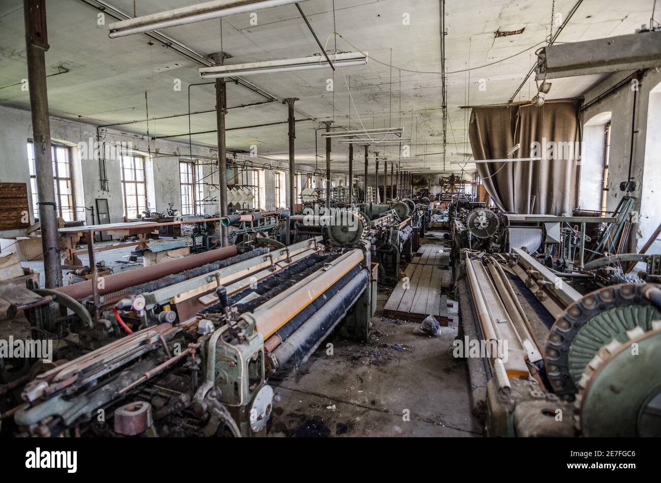 many old machines in an abandoned textile factory Stock Photo - Alamy