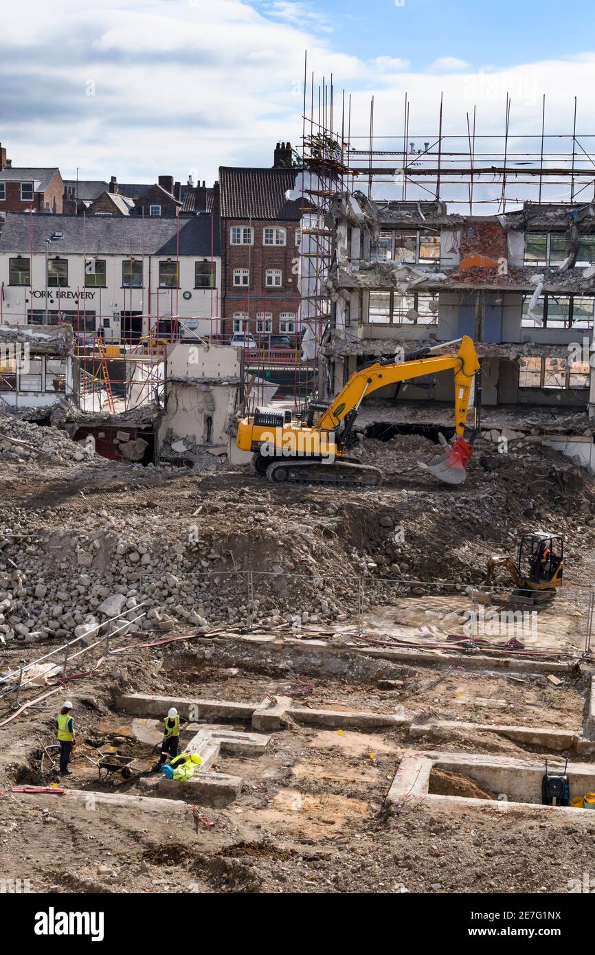 Demolition site (rubble, machinery, excavator demolishing, digger ...