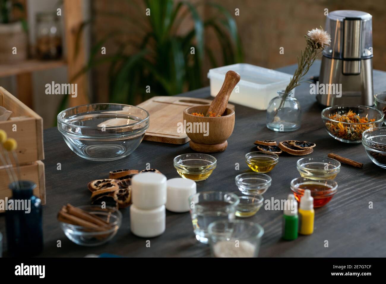 Group of containers of various sizes with essential oils, colorants and ...