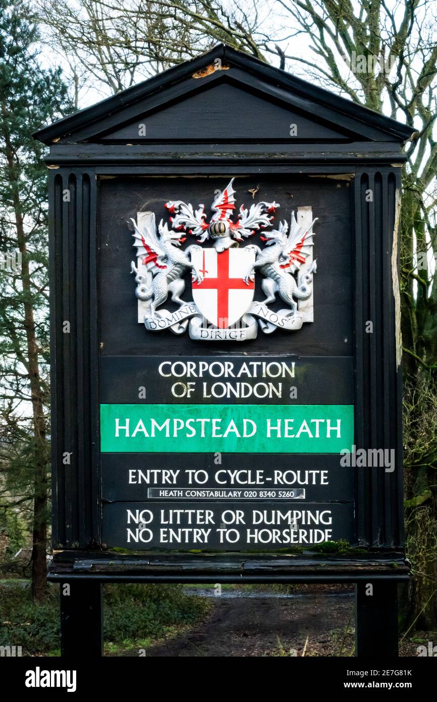 Black wooden sign depicting the coat of arms of the City of London ...