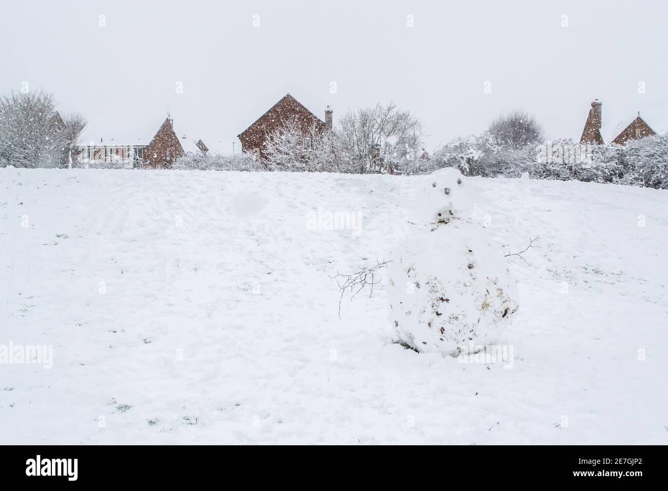 Snowman in a field on a winters day Stock Photo - Alamy