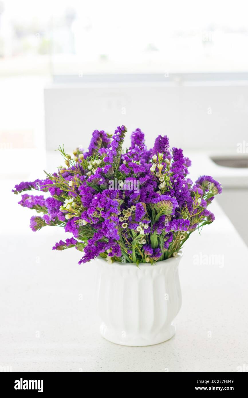 Nice flower arrangement with purple statice, decorating the spaces of a ...