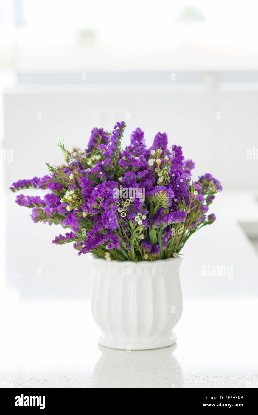 Nice flower arrangement with purple statice, decorating the spaces of a ...