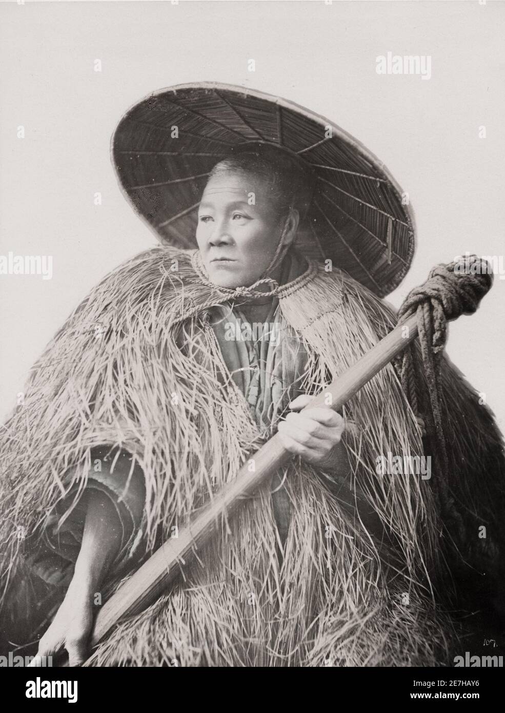 Vintage 19th century photograph: Farm worker or coolie with grass coat ...