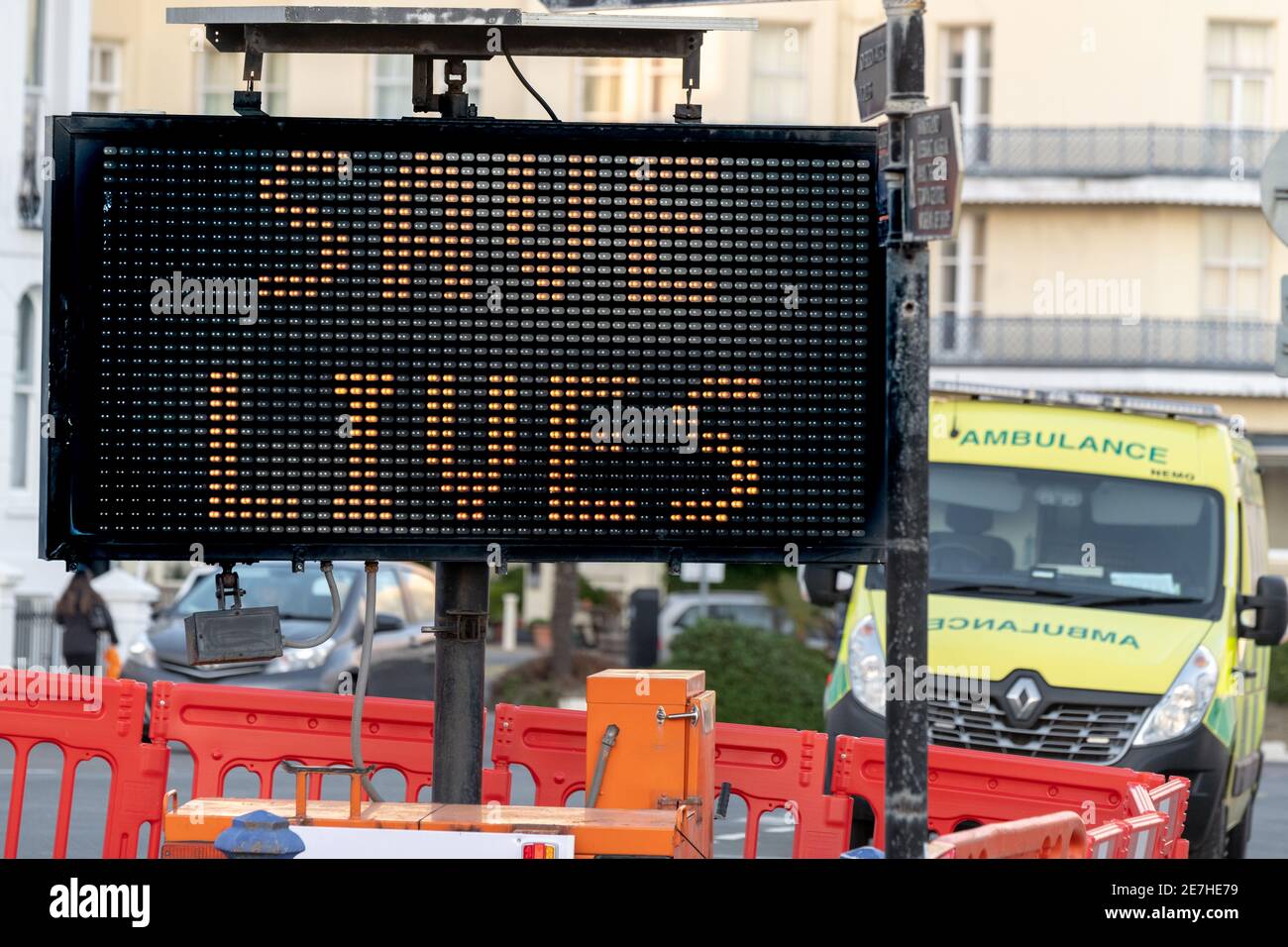 NHS Safe Lives sign in front of an amubulance during Covid pandemic and ...