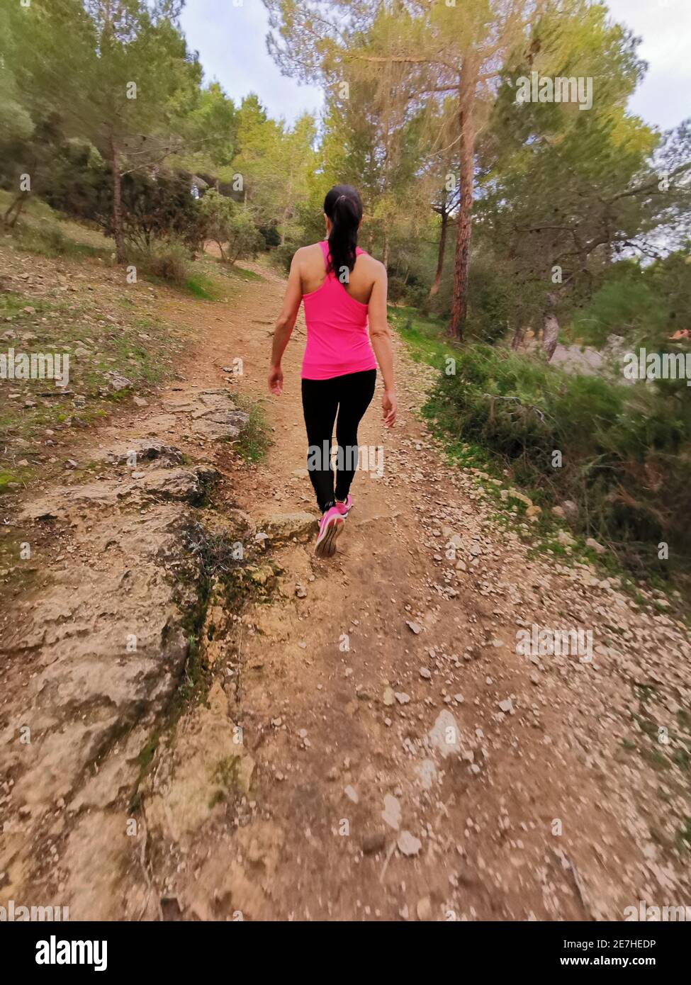 Pretty young girl runner in the forest Stock Photo - Alamy