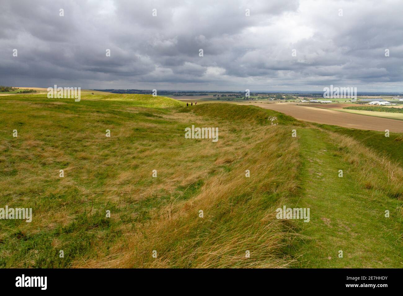 VIew along one of the earth mound edges of Barbury Castle, a scheduled ...