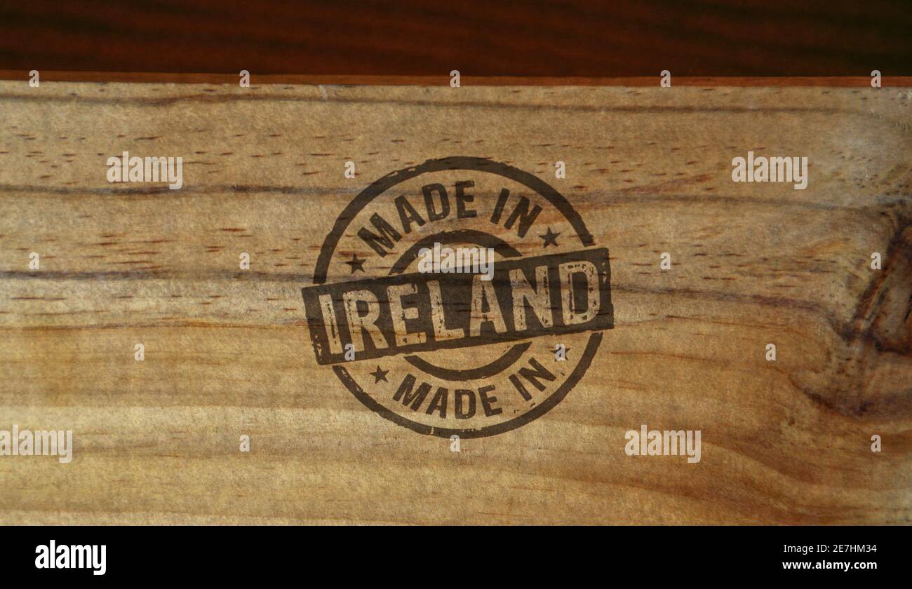 Made in Ireland stamp printed on wooden box. Factory, manufacturing and ...