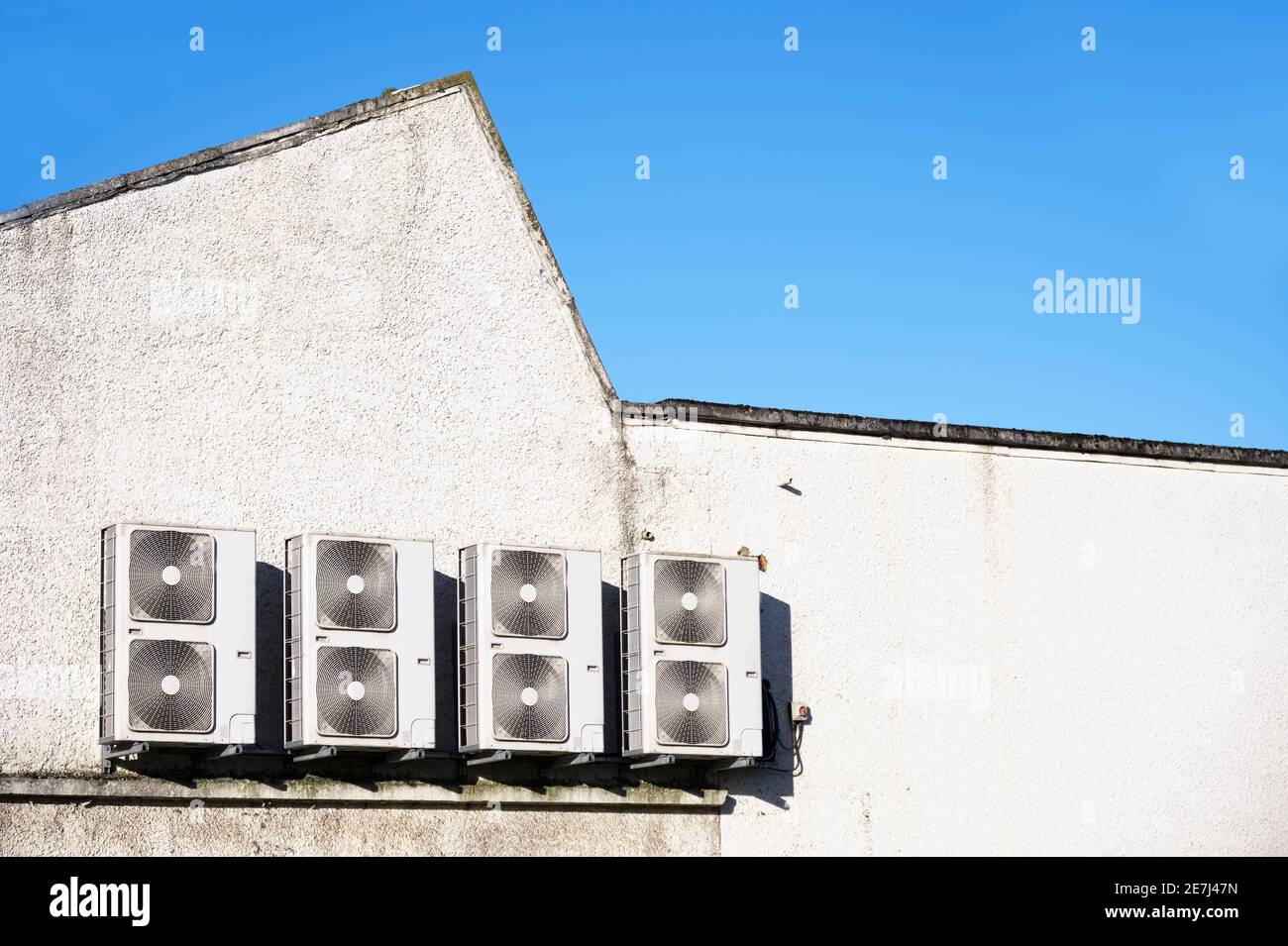 Condenser units for air conditioning system wall mounted outdoors Stock ...