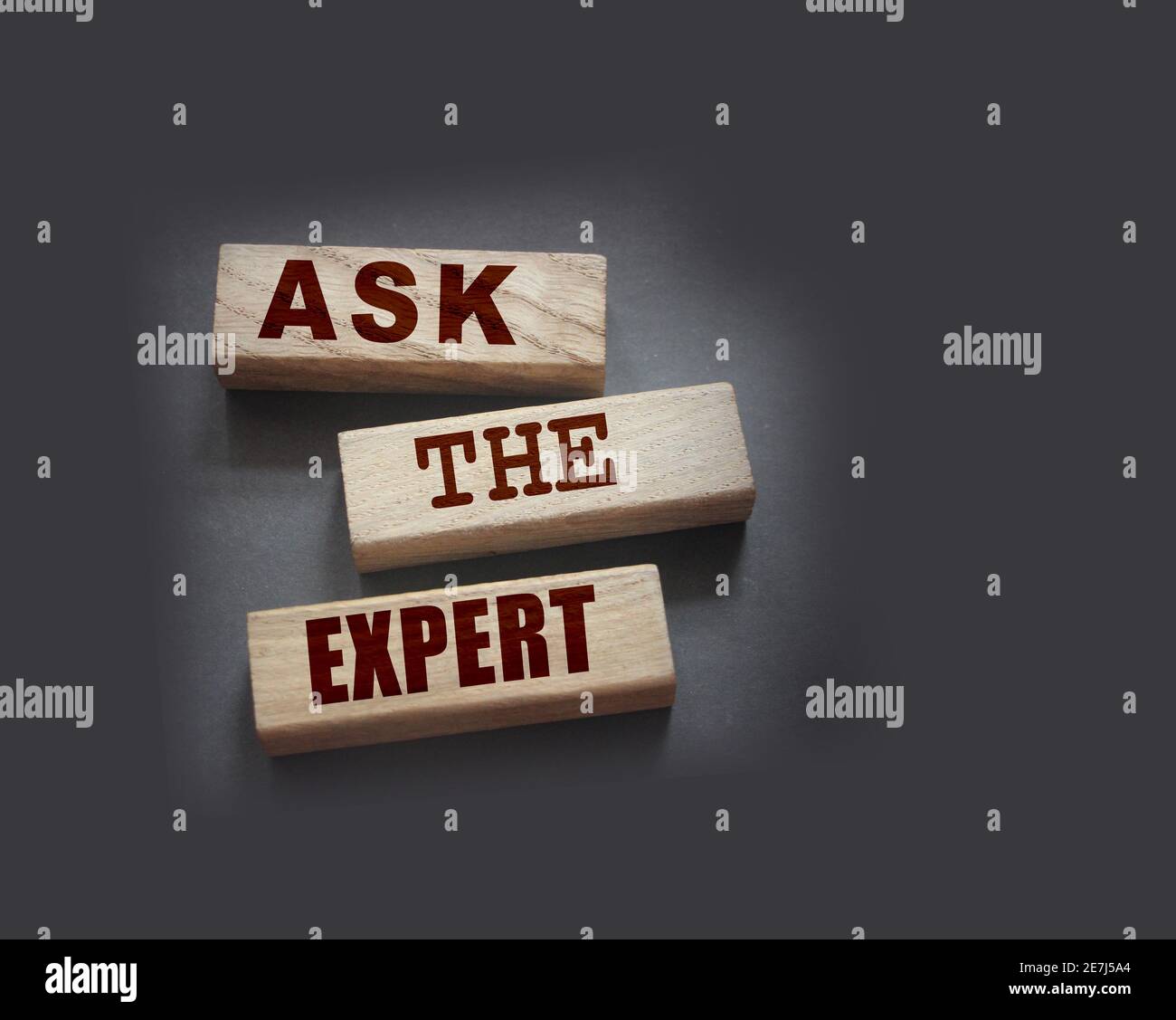 Ask the Expert words on wooden blocks. Consulting a professional ...
