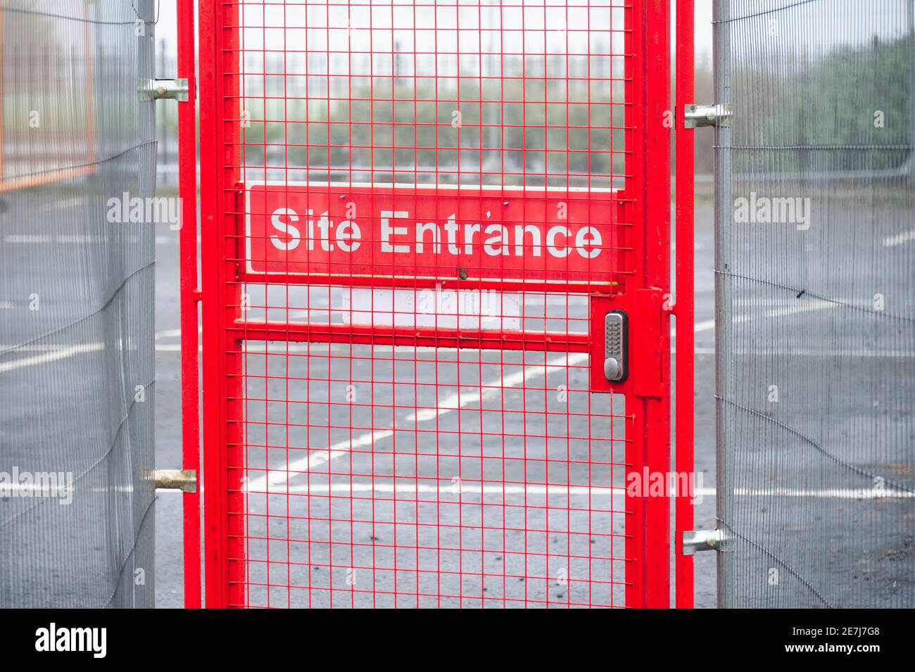 Construction building site sign at entrance on gate Stock Photo - Alamy