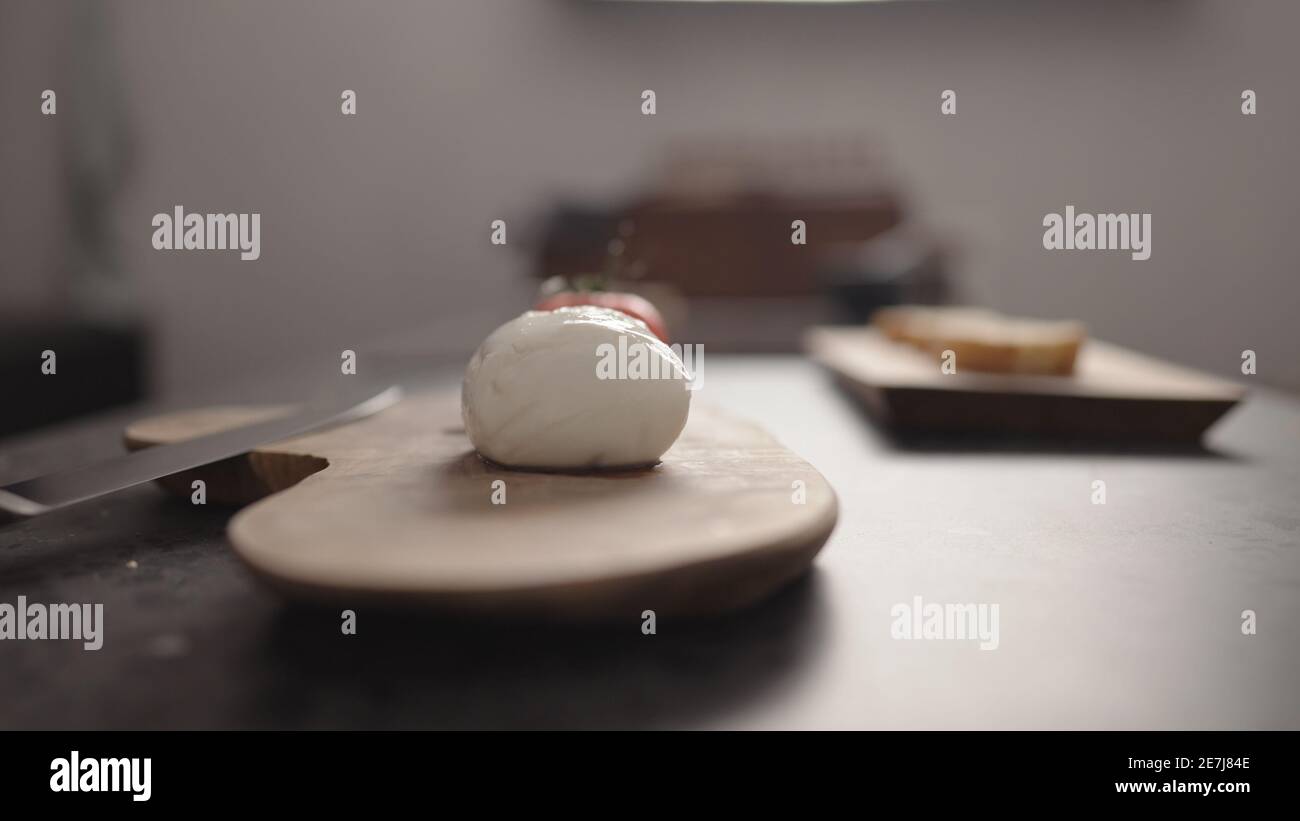 Man slicing fresh mozzarella hi-res stock photography and images - Alamy