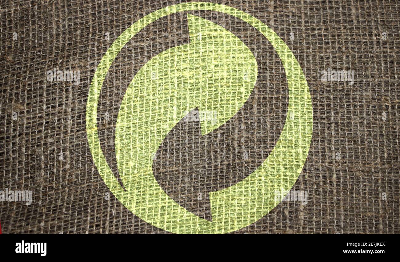 Recycle symbol on rough textile fabric. Concept of environment ...