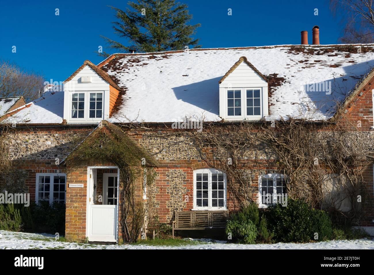 Traditional brick and flint cottage in a village in the Chilterns ...