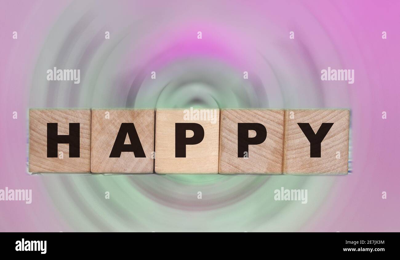 Happy word wooden cubes on a ocean background. Lifestyle concept Stock ...