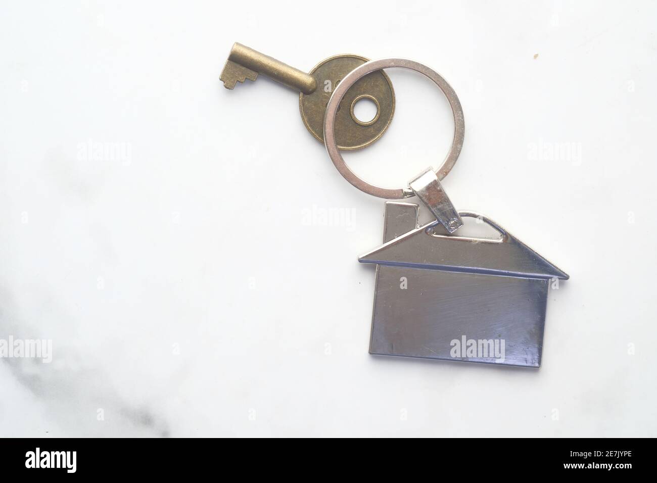home finance concept with key and house symbol on white Stock Photo - Alamy