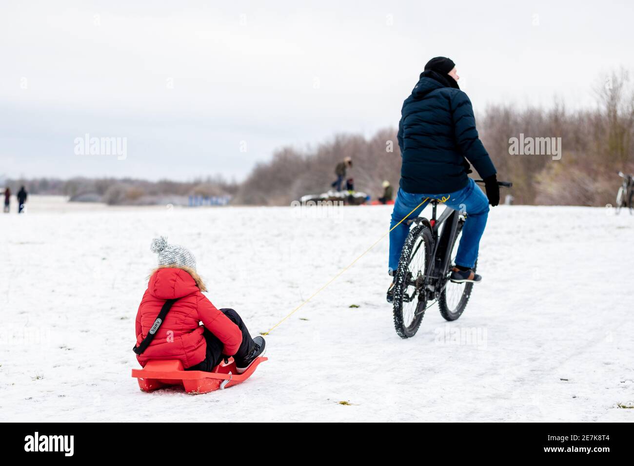 Father pulls child sled hi-res stock photography and images - Alamy