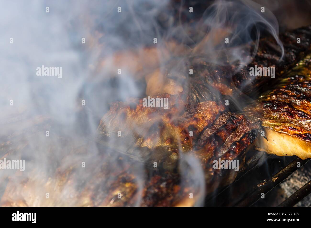 Grilled mackerel fish with smoke on a charcoal barbecue grill Stock ...