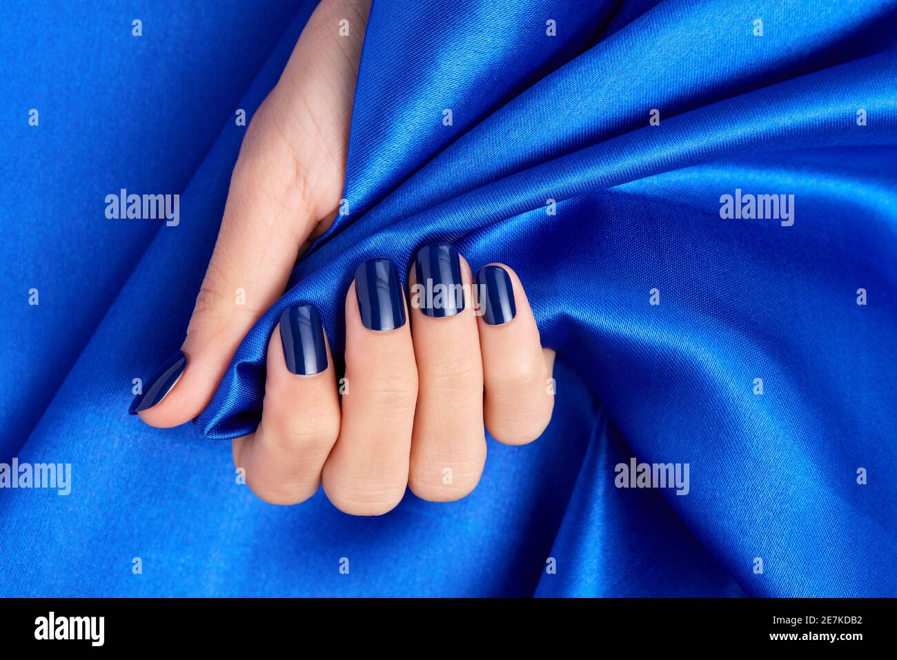 Blue satin hand hi-res stock photography and images - Alamy