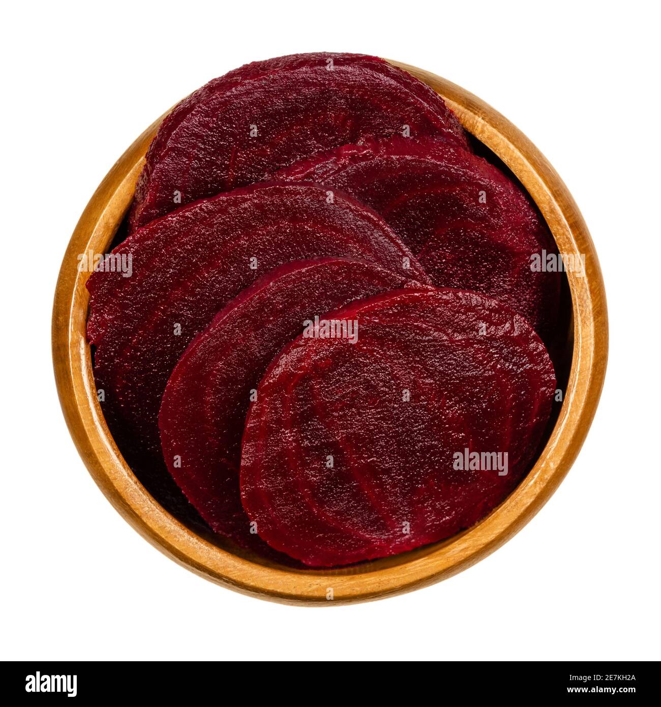 Cooked beetroot slices in a wooden bowl. Boiled sliced red beets also ...