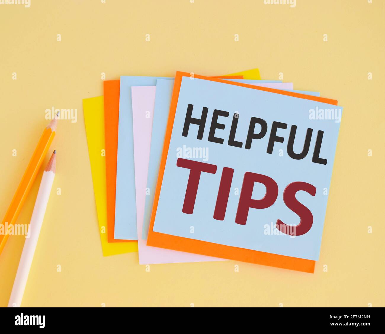 Helpful Tips text written on colorful notes. Concept meaning Ask an ...