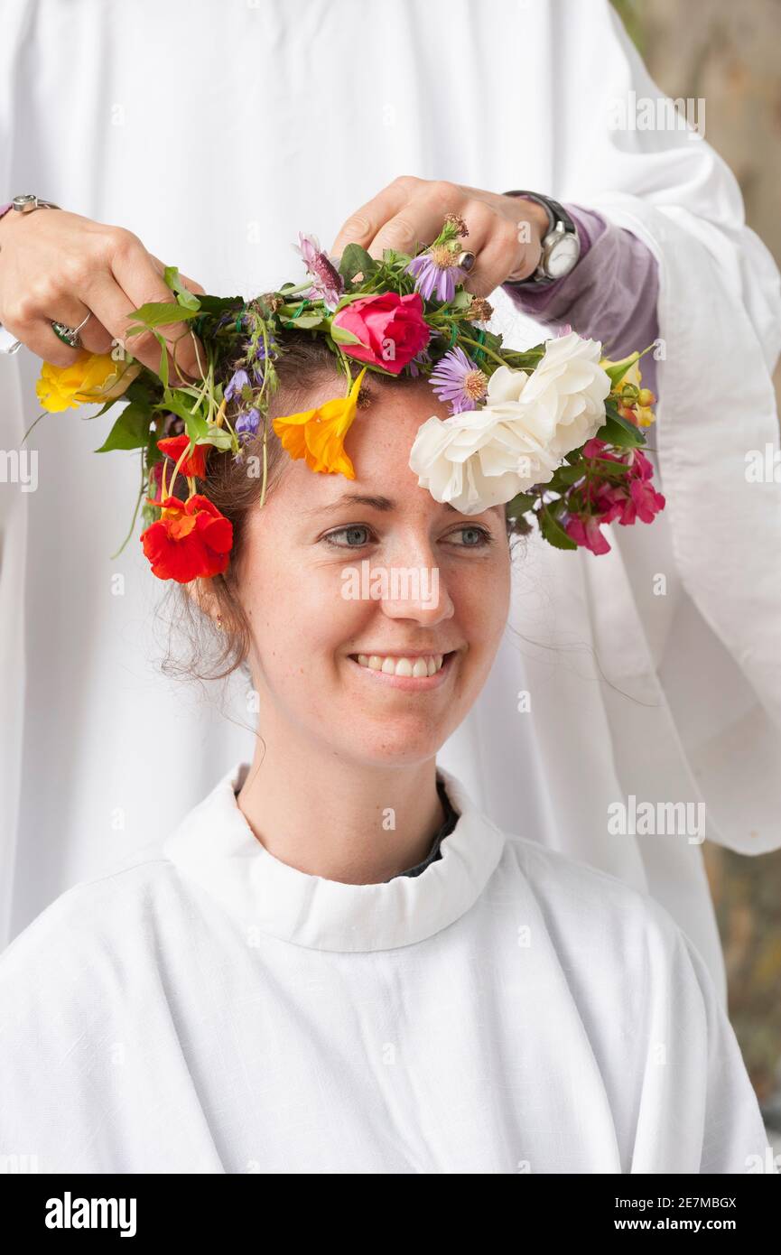 A female members of The Druid Order, wearing a garland of flowers ...