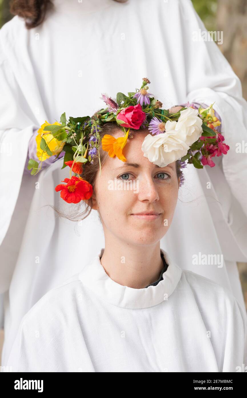 A female members of The Druid Order, wearing a garland of flowers ...