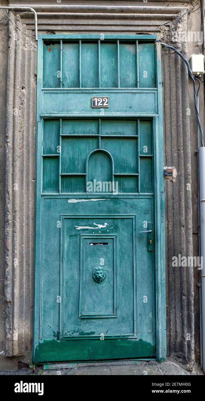 An old green rusty metal door. Front door Stock Photo - Alamy