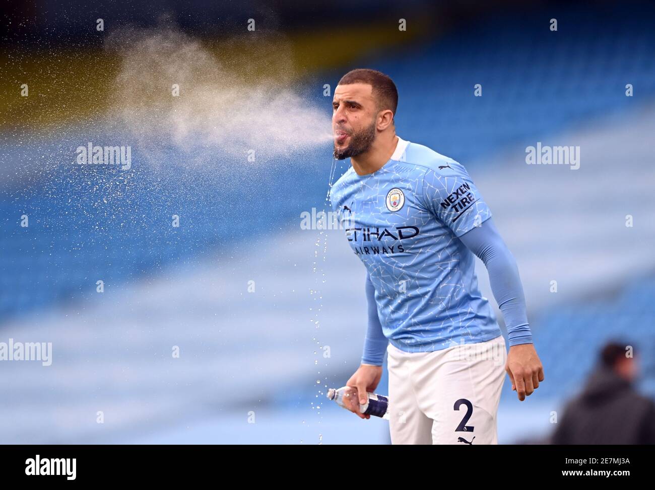 Manchester City's Kyle Walker spits out water ahead of the Premier ...