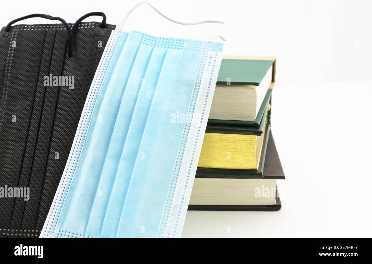 Black and blue medical face masks with books reflect pandemic need to ...