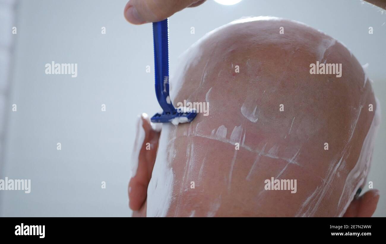 Buddhist monk shaving head hi-res stock photography and images - Alamy