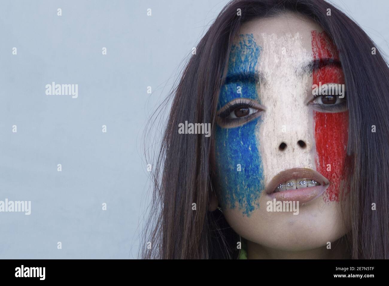 Flag of France painted on a face of a french young female Stock Photo ...