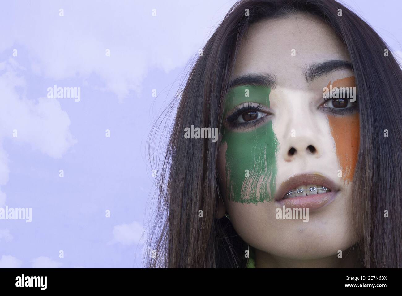 Flag of Ireland painted on a face of a young female Stock Photo - Alamy