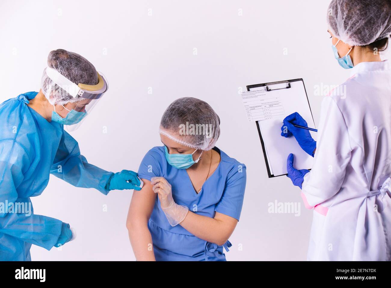 Vaccination of medical personnel on a white background and a covid ...