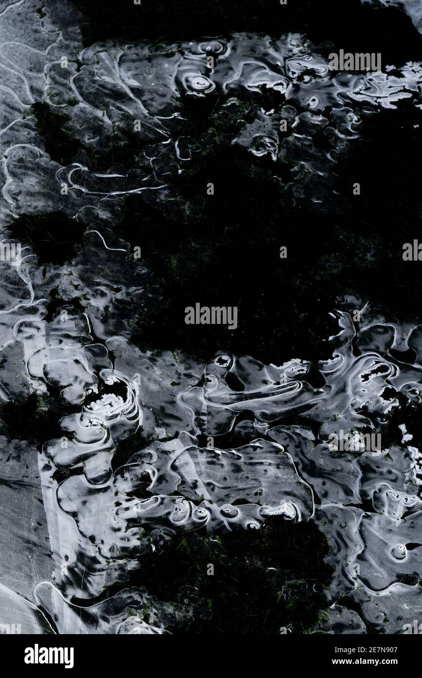 Abstract image of a frozen puddle Stock Photo - Alamy