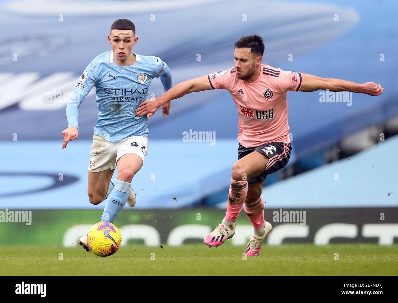Manchester City's Phil Foden and Sheffield United's George Baldock ...