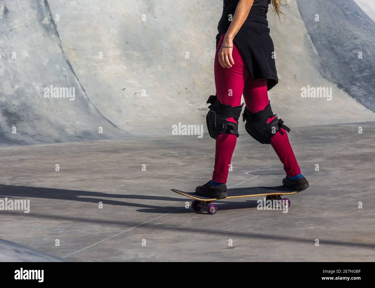 Young person skateboarding in a skatepark Stock Photo - Alamy
