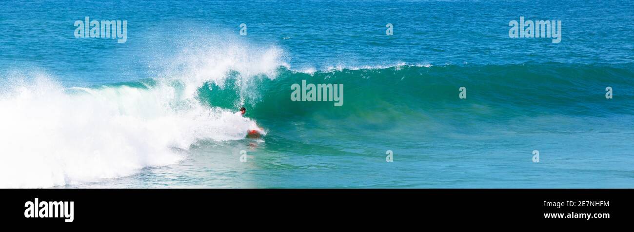 Surfer surfing on crazy sea waves on a sunny day Stock Photo - Alamy
