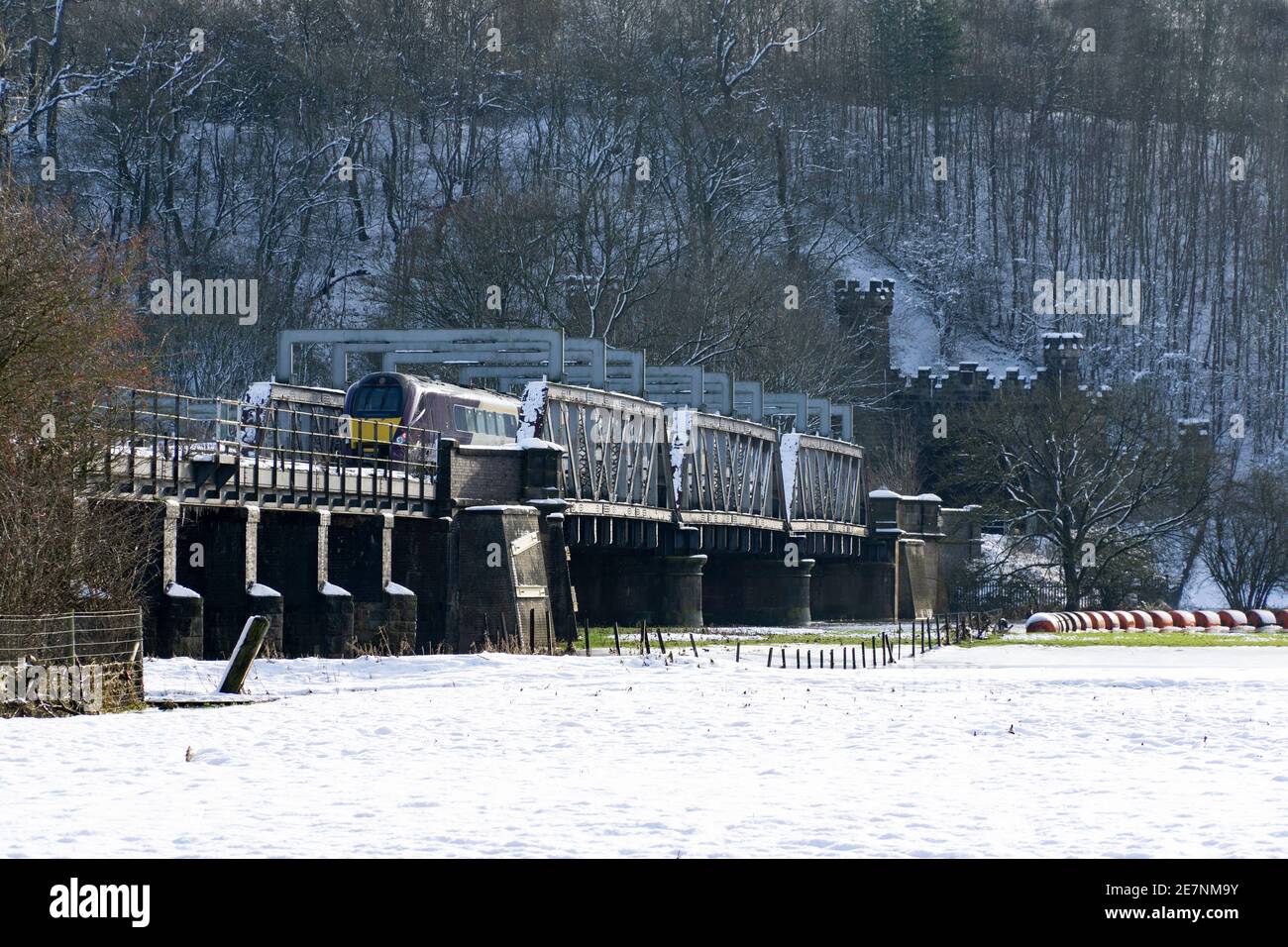 Long steel railway bridge and tunnel entrance in winter Stock Photo - Alamy