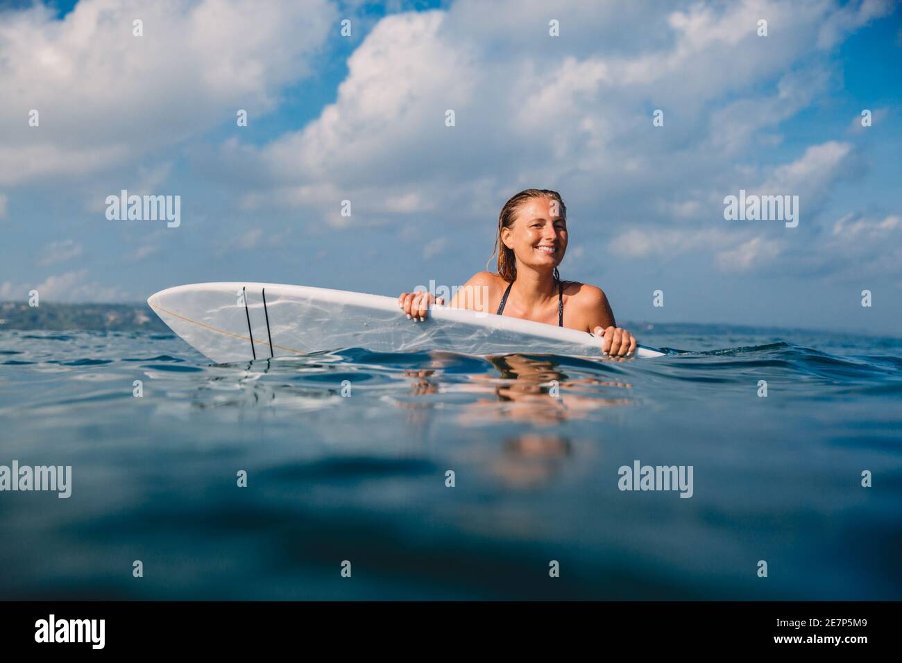 Attractive surfing woman with surfboard. Happy surf girl on surfboard ...
