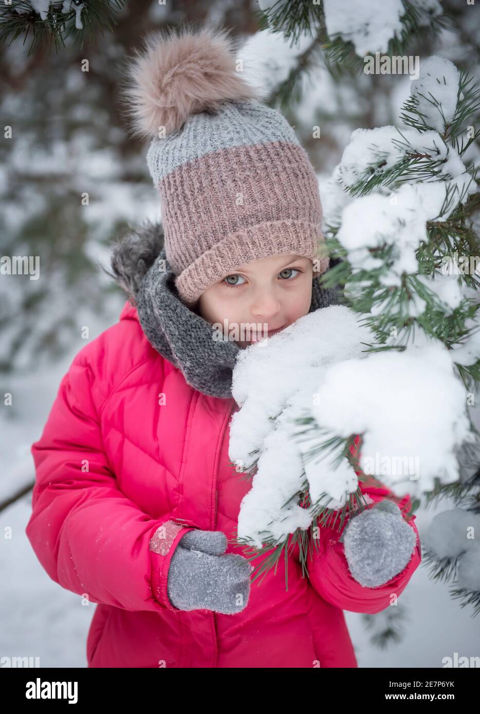 Child in winter. A little girl, playing in the winter outside. A ...