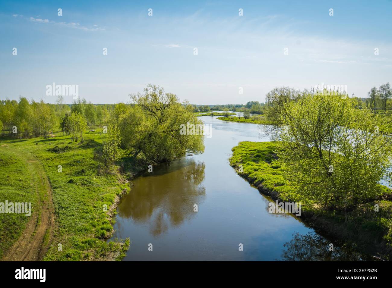 Summer rural landscape with river and blue sky background Stock Photo ...