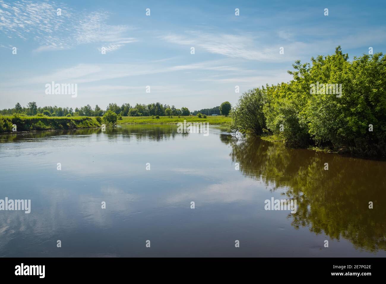 Summer rural landscape with river and blue sky background Stock Photo ...