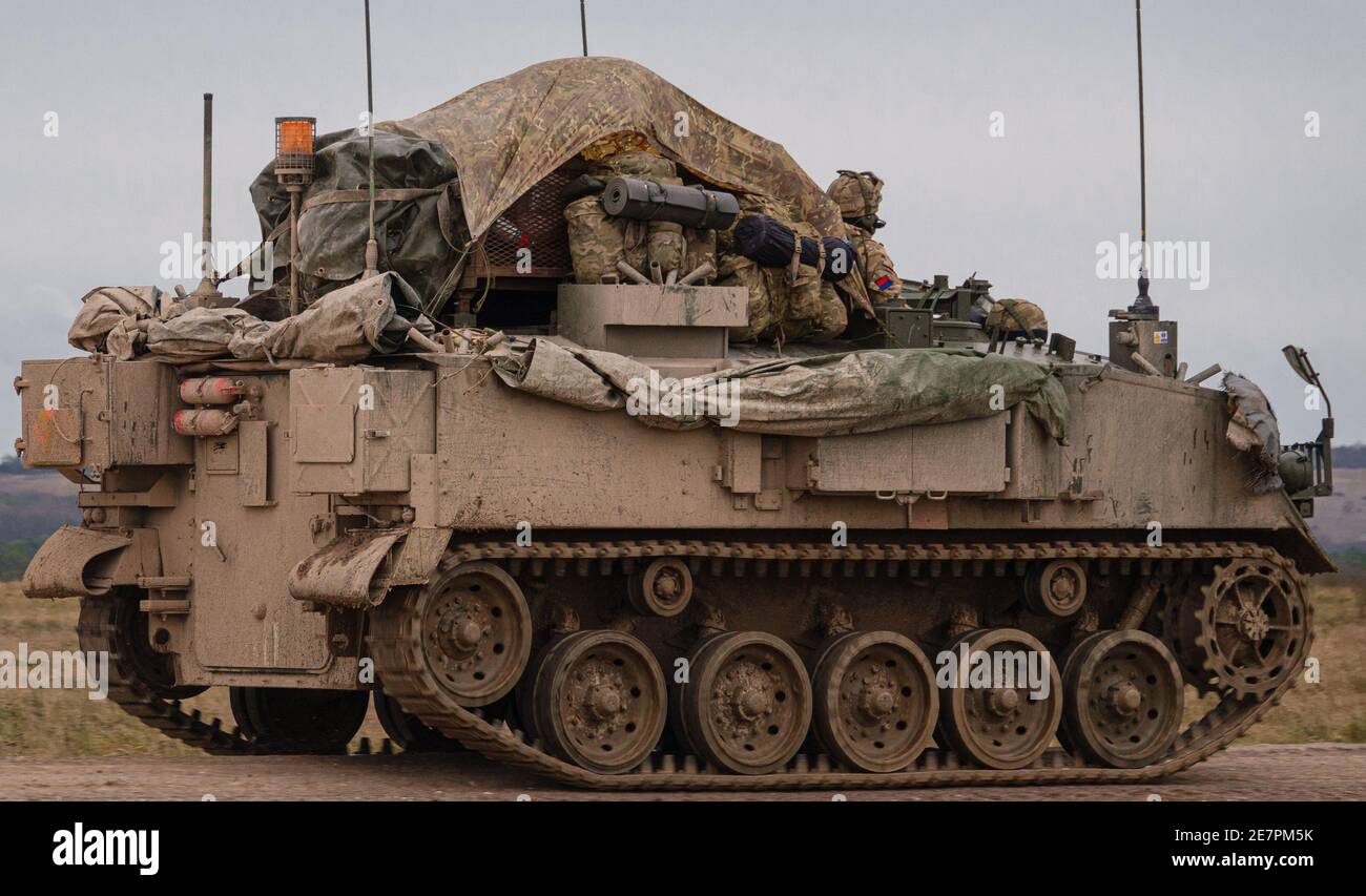 FV430 in motion, fully loaded with troop bergens under a tarpaulin ...
