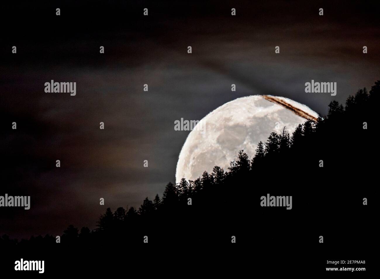 Jet contrails; Full Wolf Moon rising over Rocky Mountains, Salida ...