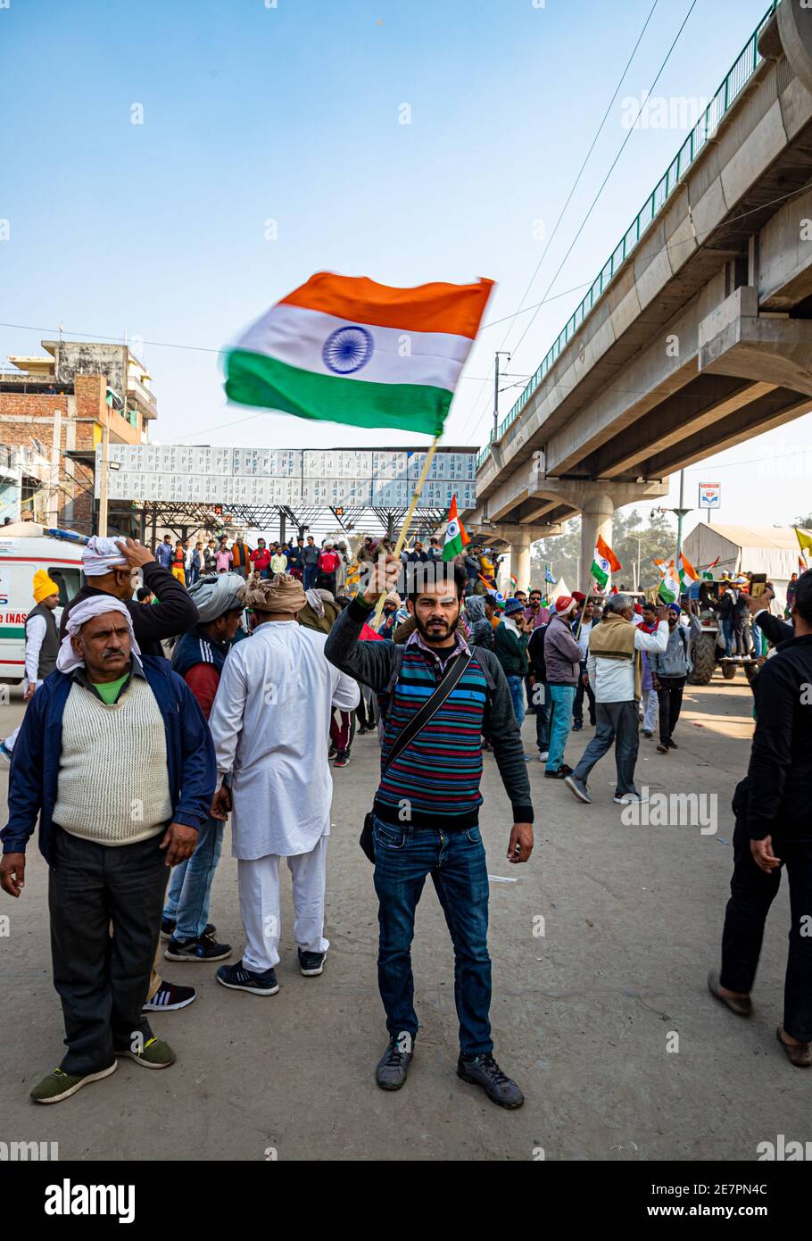 a man with indian flag during farmers protest at tikri border,delhi ...