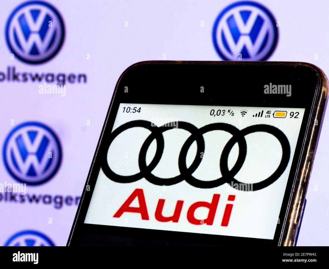 In this photo illustration, an Audi logo seen displayed on a smartphone ...