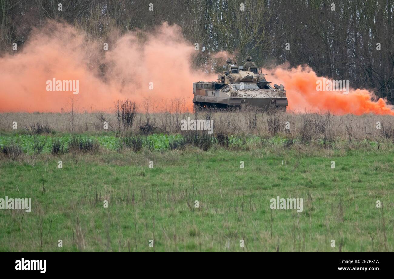 british army warrior fv510 light tank in action on a military exercise ...